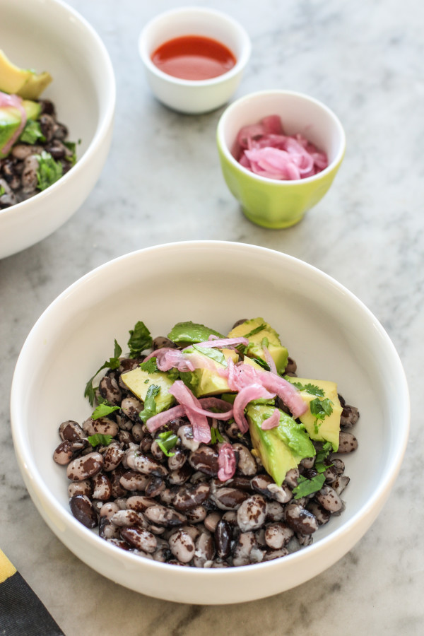 orca beans with avocado, cilantro, and pickled red onions